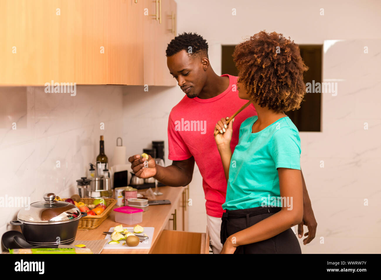 Black African American couple preparing food in the kitchen Stock Photo ...