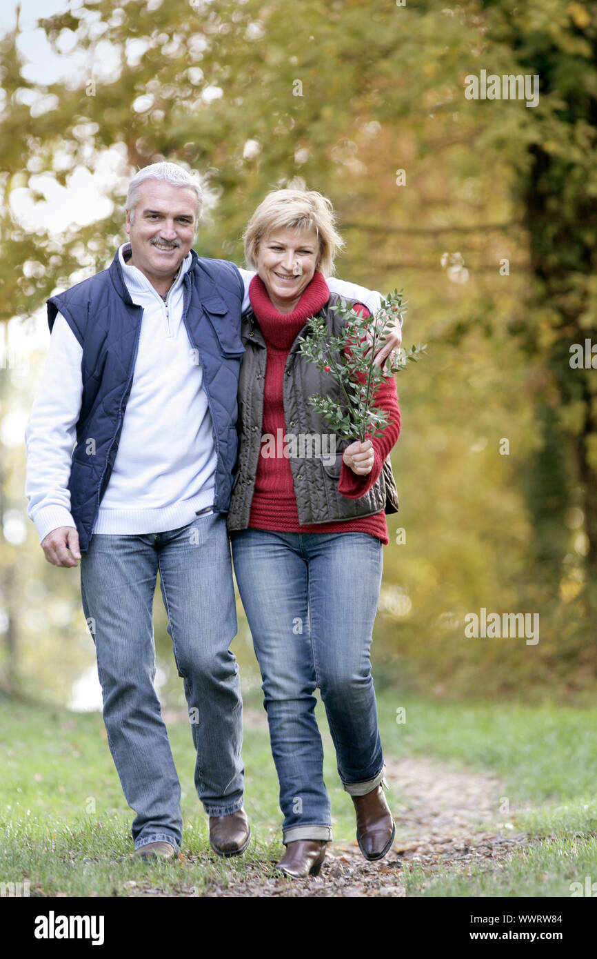 Couple taking leisurely walk Stock Photo - Alamy