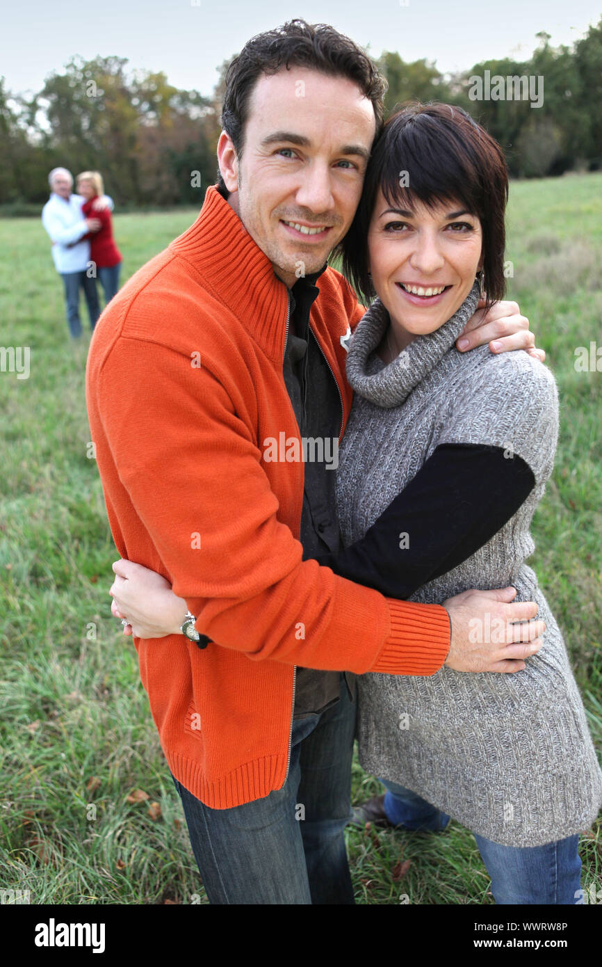 Happy hugging mature couples hi-res stock photography and images - Alamy