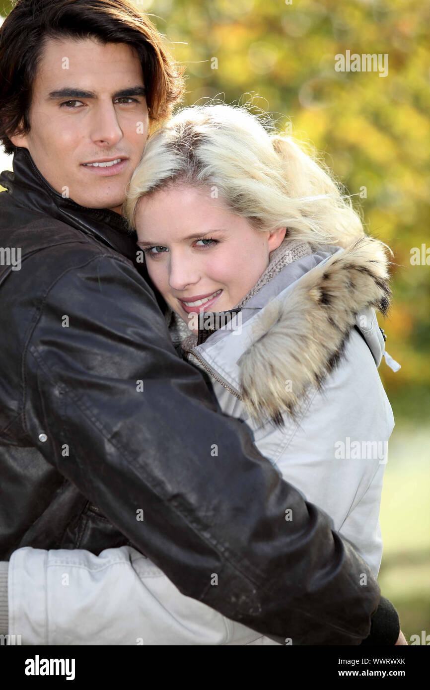 Couple wearing winter coats Stock Photo - Alamy