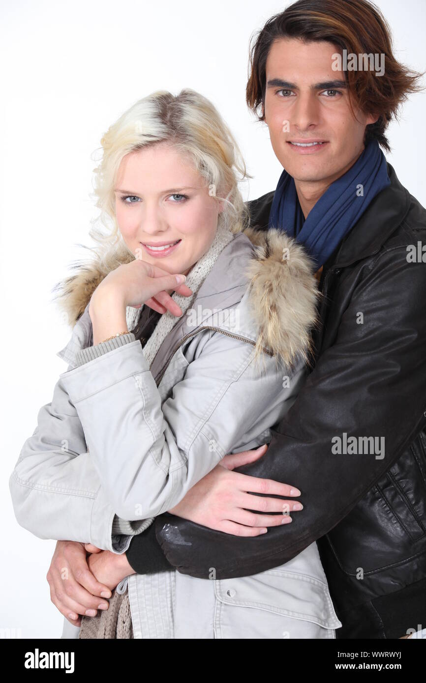 Couple wearing winter coats Stock Photo - Alamy