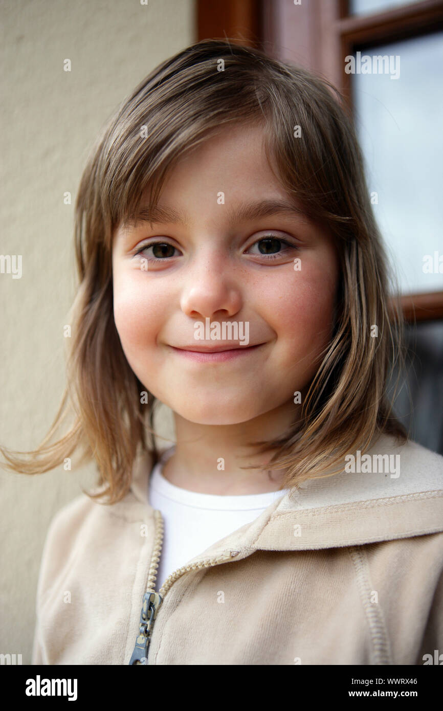 Little girl stood outside house Stock Photo - Alamy