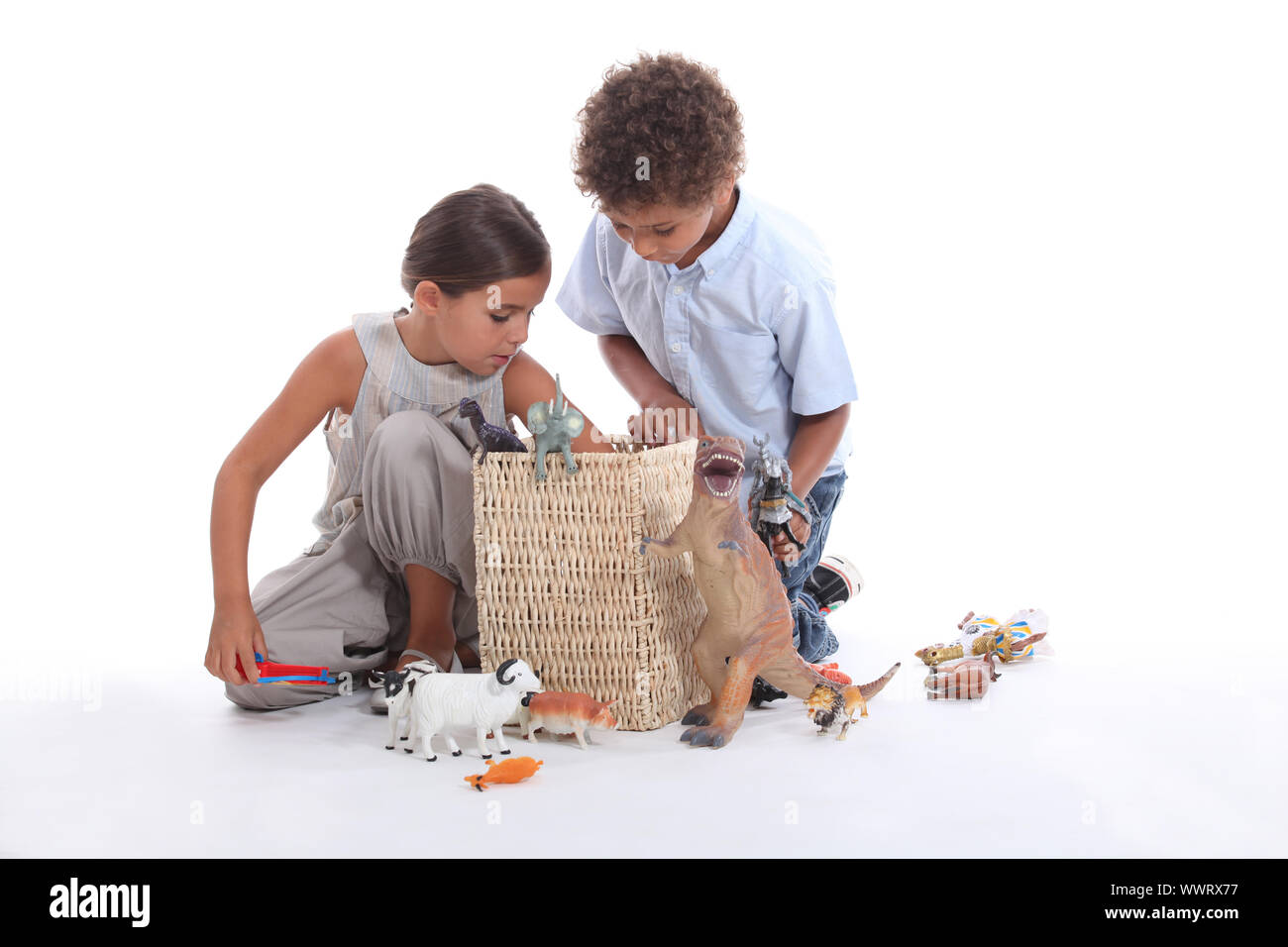 Young children playing with toys Stock Photo - Alamy