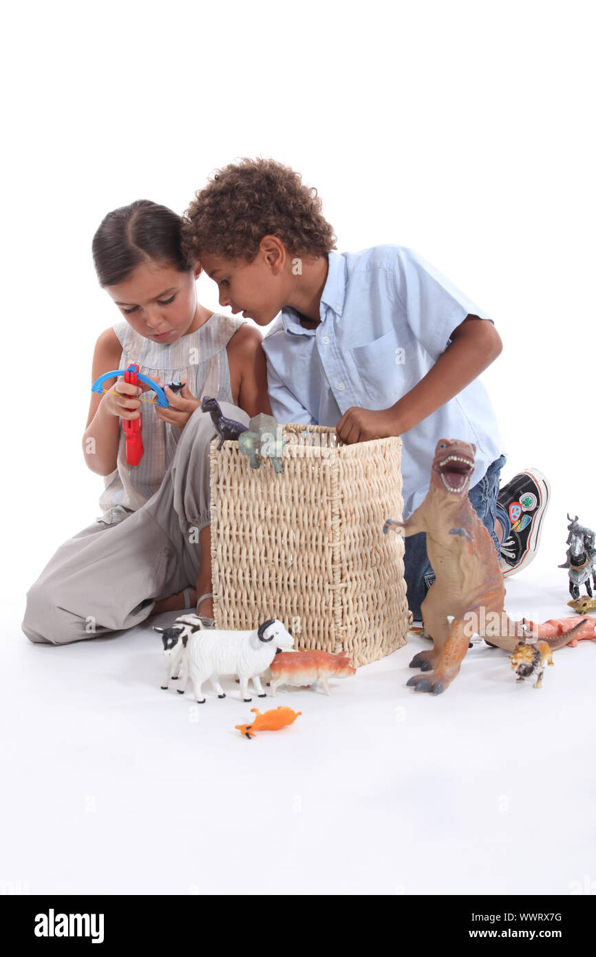 Kids playing with toys Stock Photo - Alamy