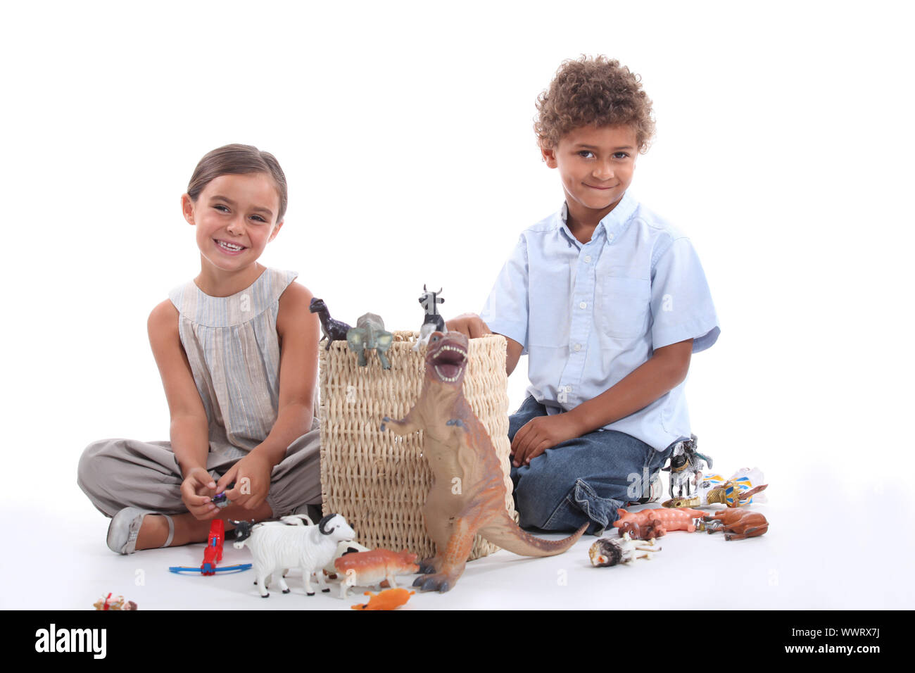 Children playing with plastic toy figurines Stock Photo - Alamy