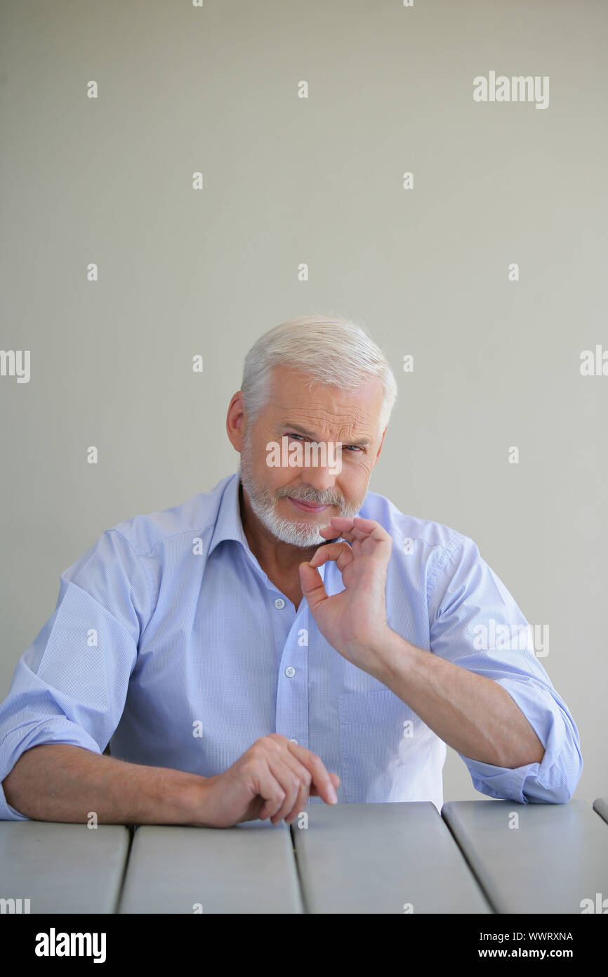 Elderly man giving the a-ok sign Stock Photo - Alamy