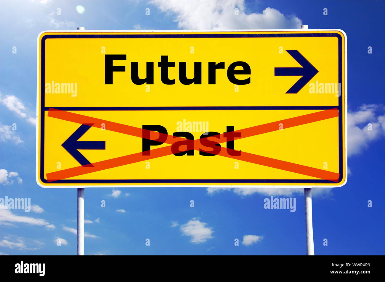 future and past concept with yellow road sign Stock Photo - Alamy