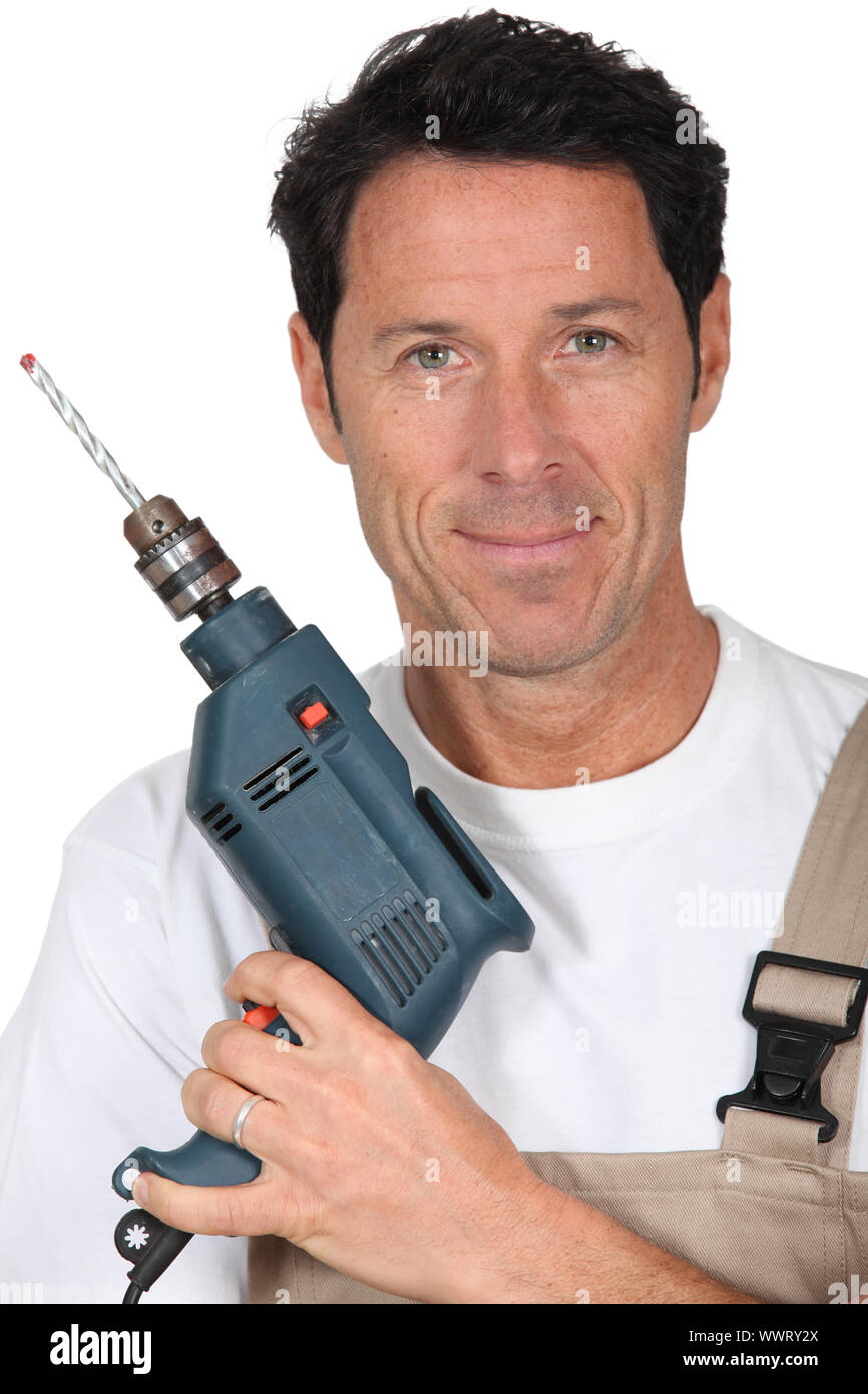 Closeup smiling man with power drill Stock Photo - Alamy