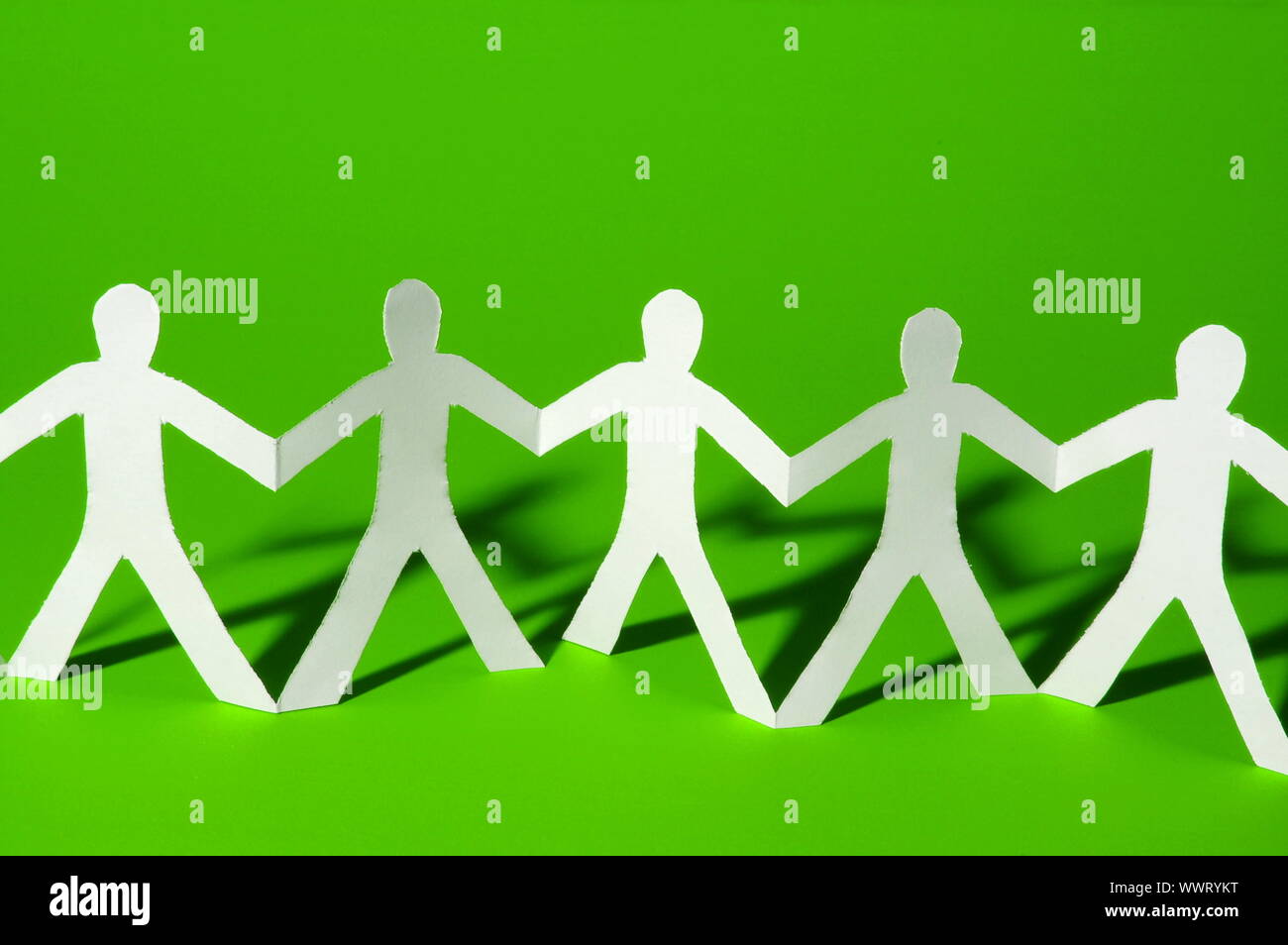 paper people doing teamwork in their business Stock Photo - Alamy