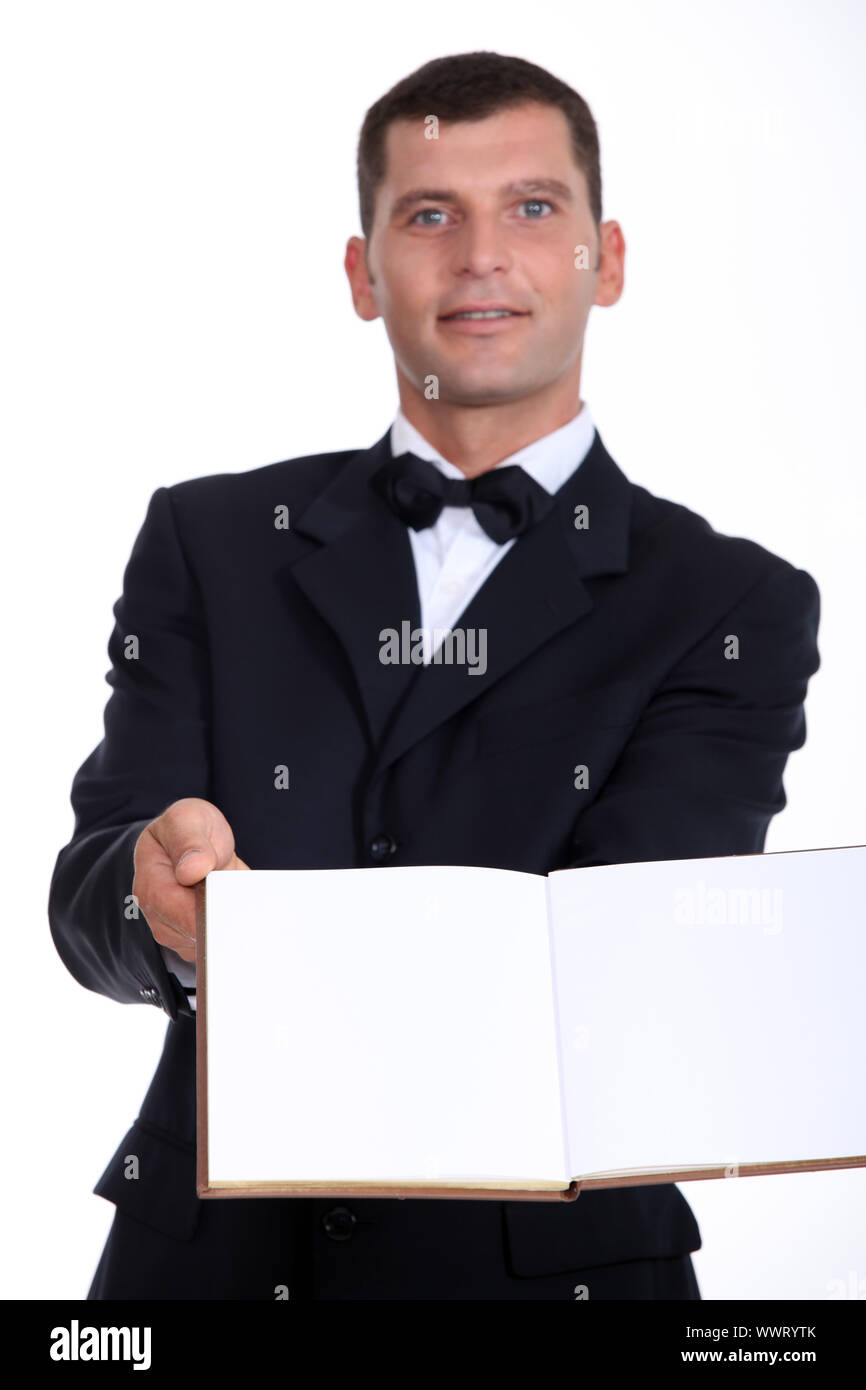 waiter reaching out menu Stock Photo - Alamy