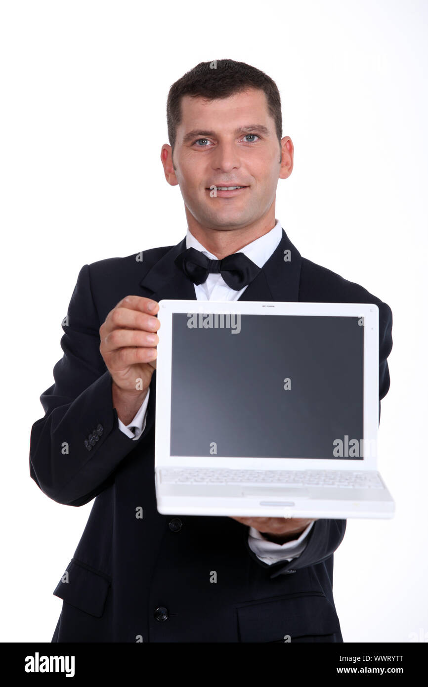 Man presenting laptop Stock Photo - Alamy