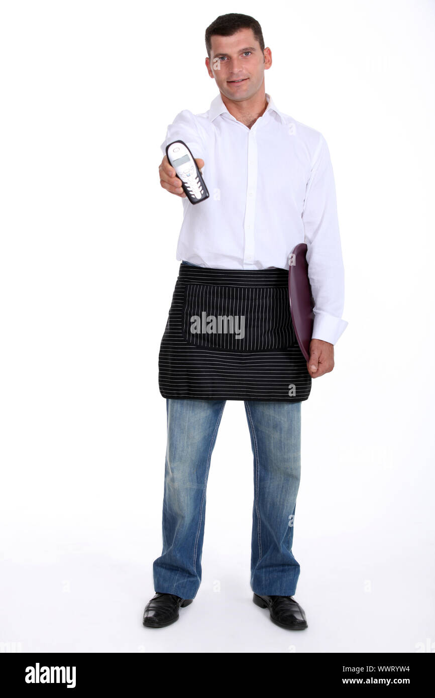 Waitor giving telephone Stock Photo - Alamy