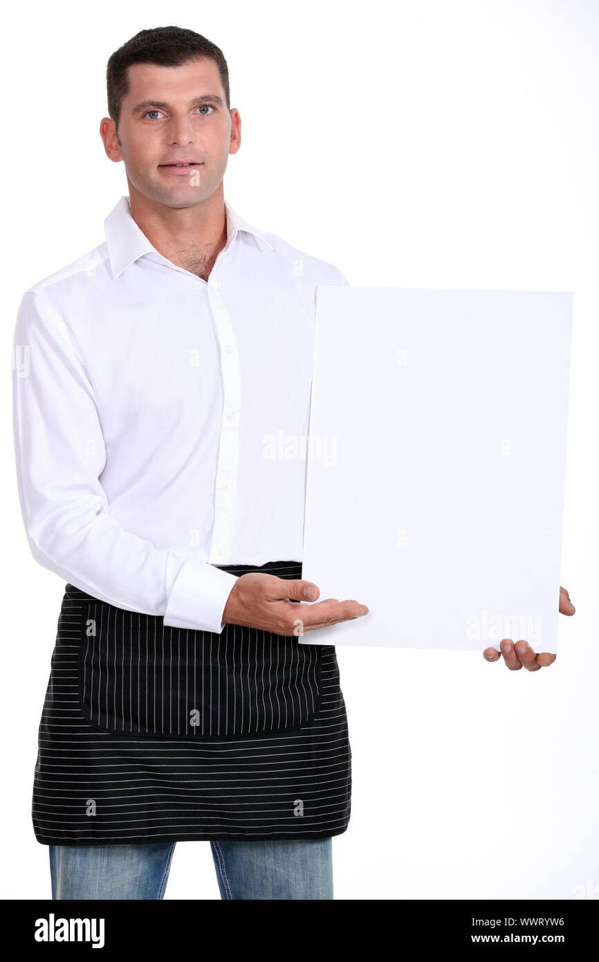 Man presenting white panel Stock Photo - Alamy
