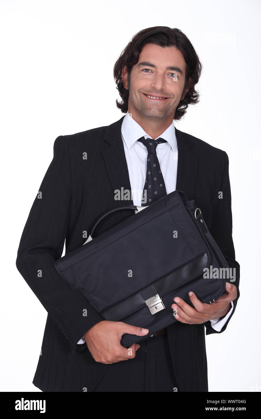businessman holding a briefcase Stock Photo - Alamy