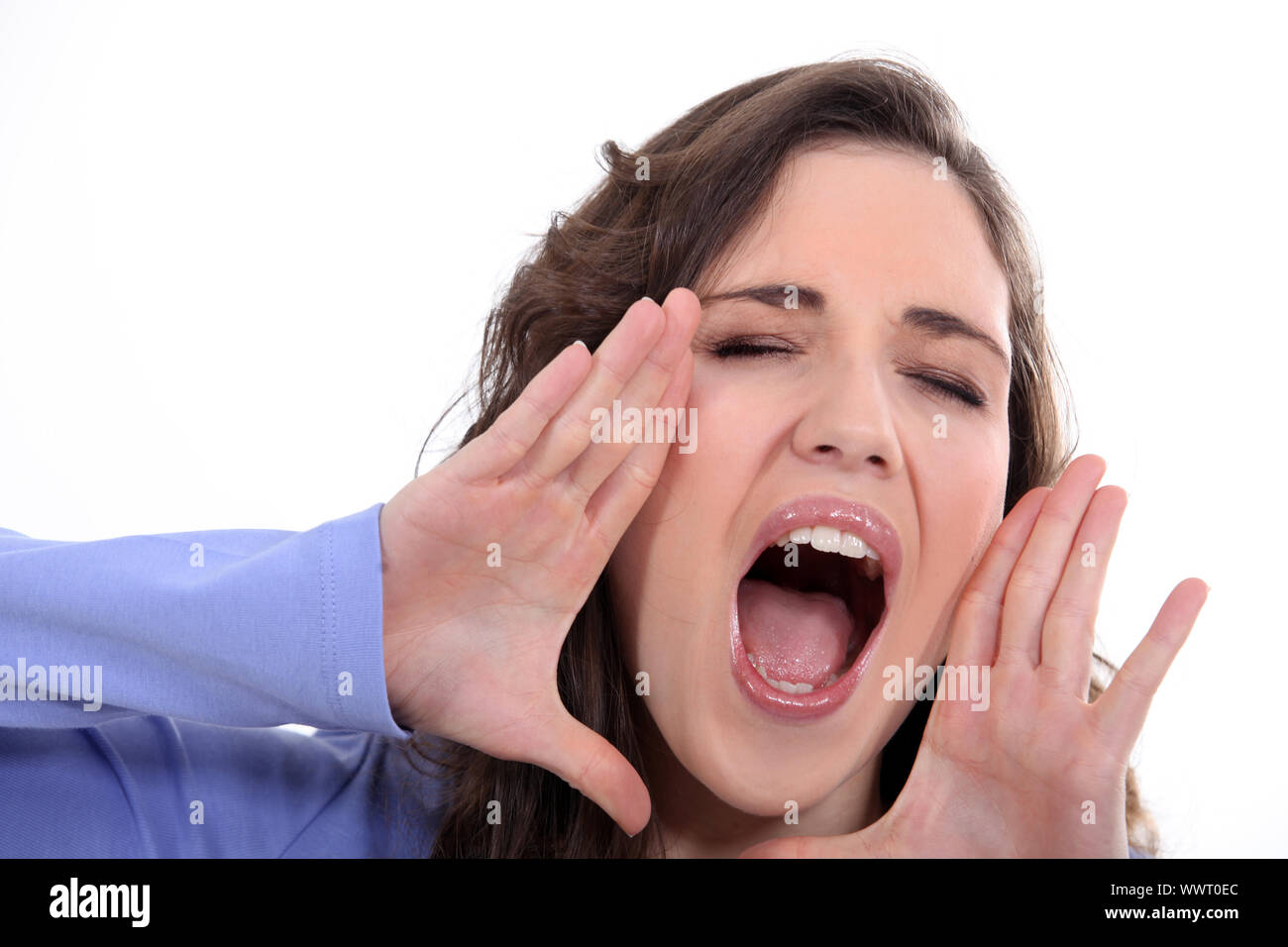 Woman yelling on white background Stock Photo - Alamy