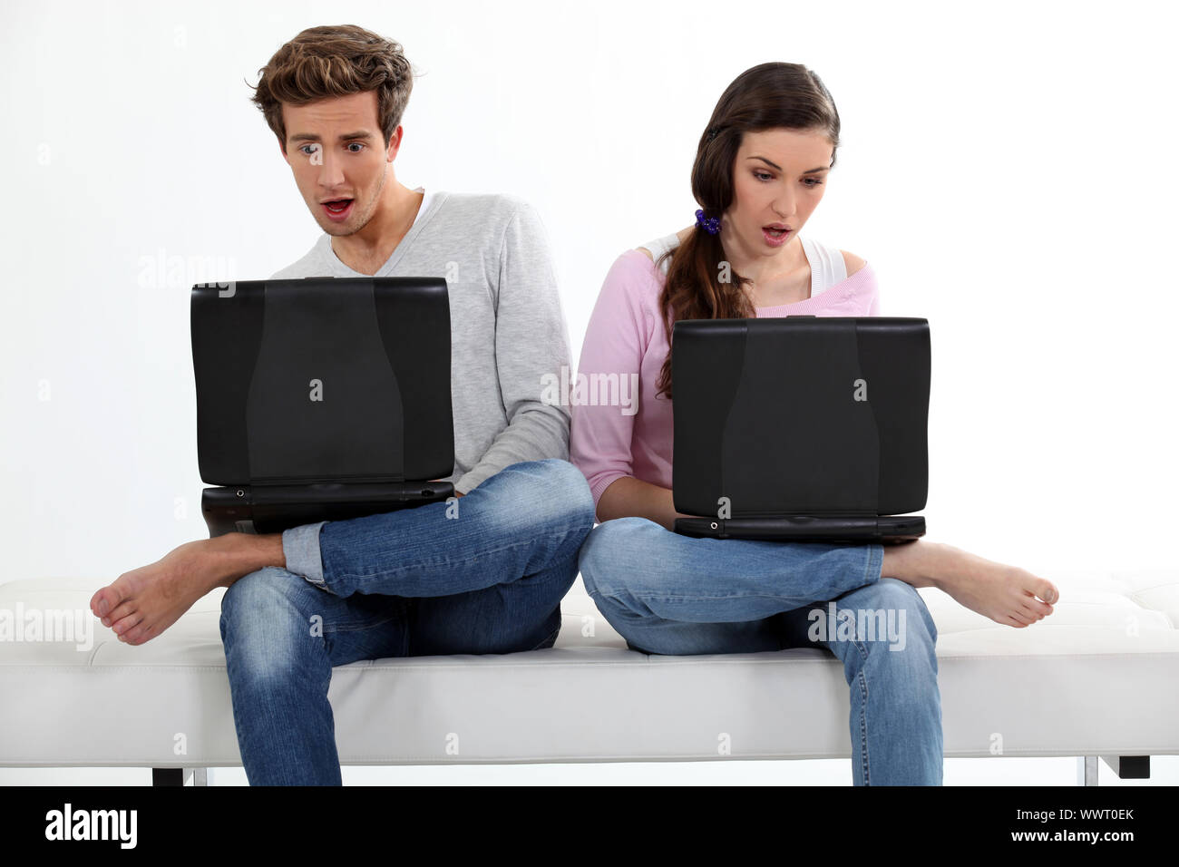 Shocked people in front of laptops Stock Photo - Alamy
