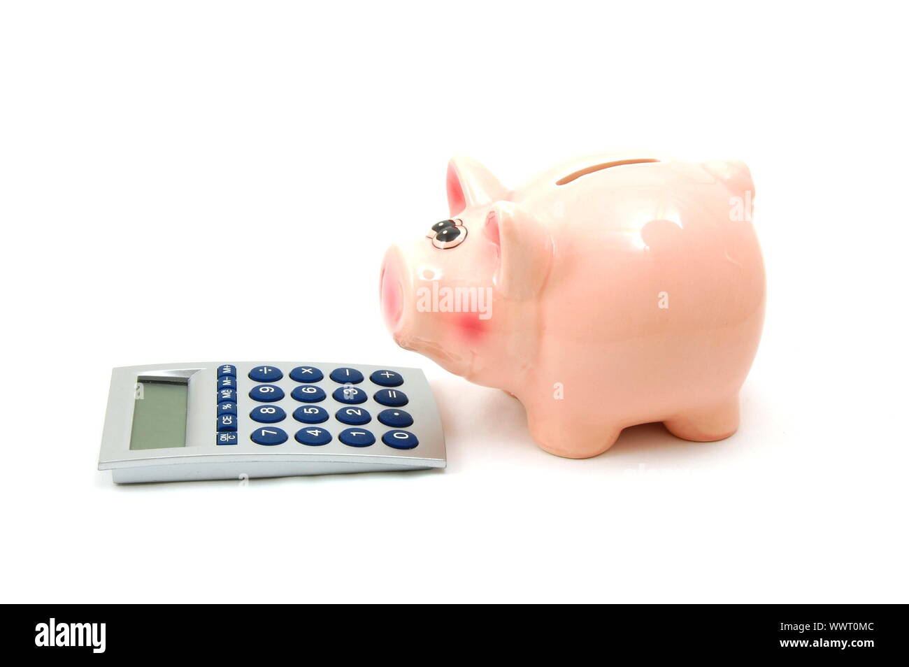 saving money with a piggy bank isolated on white Stock Photo - Alamy