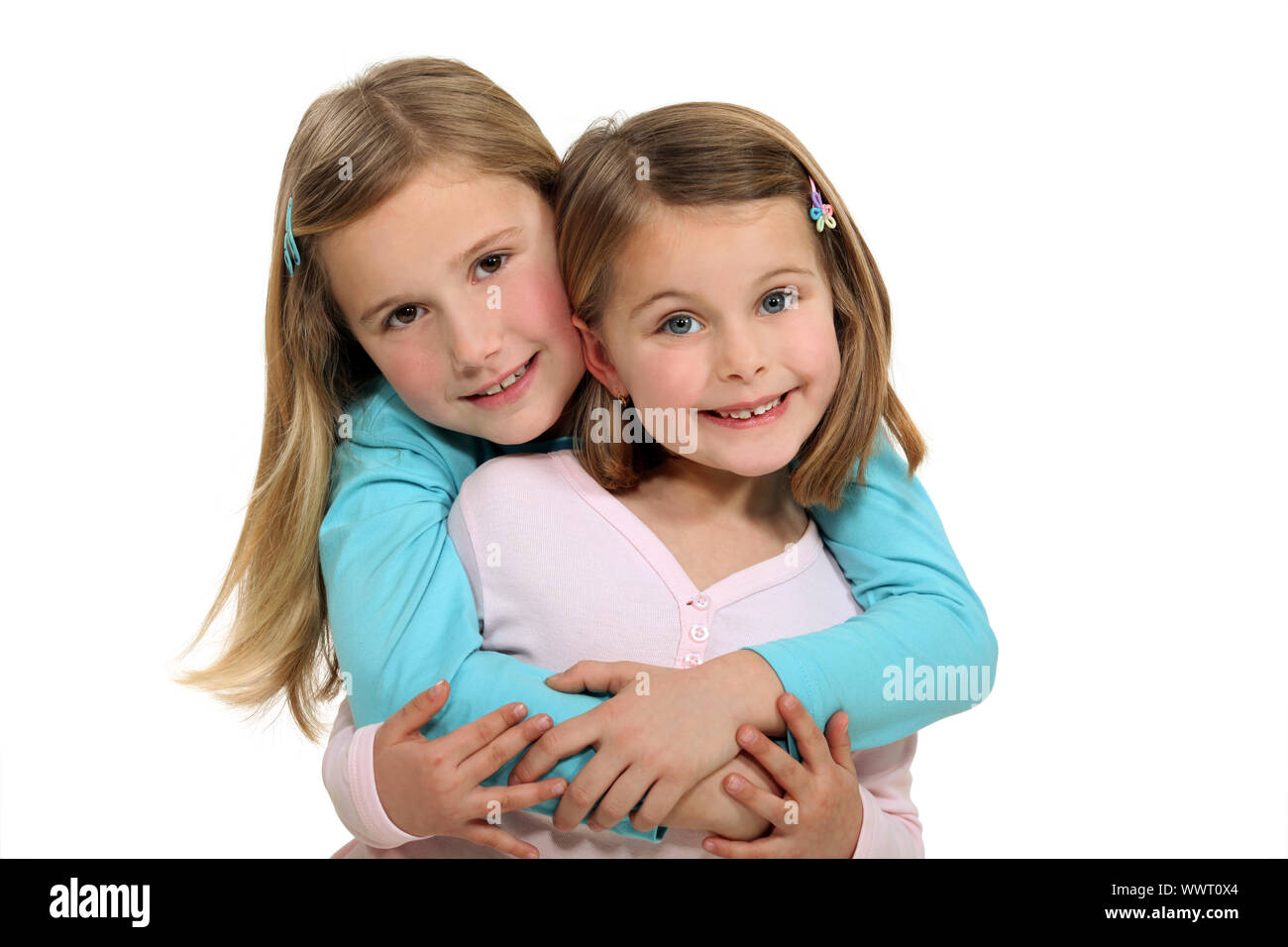 Two sisters hugging Stock Photo - Alamy