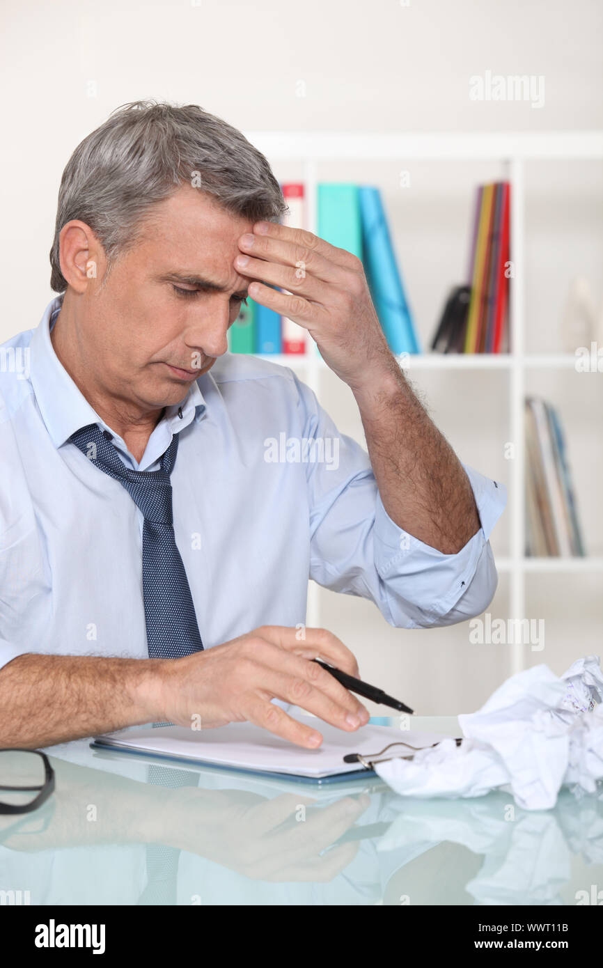Businessman struggling desk hi-res stock photography and images - Alamy