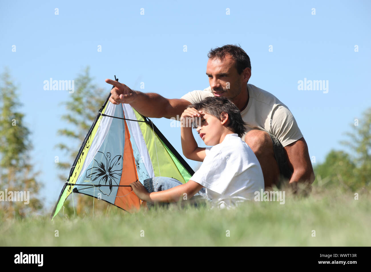 Father and son flying kite Stock Photo - Alamy