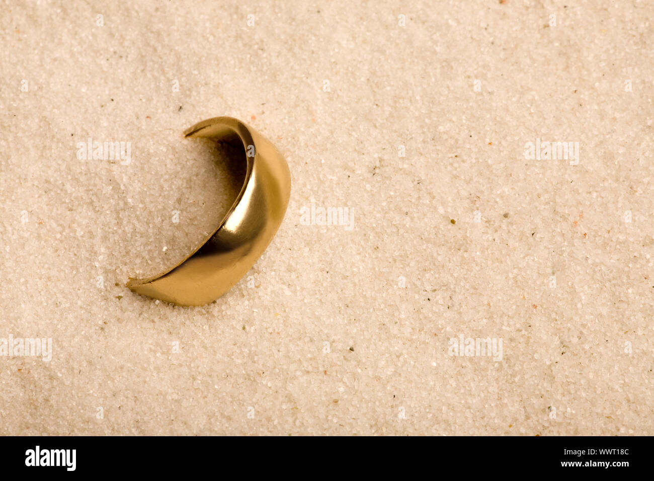 Wedding Ring in Sand Stock Photo - Alamy