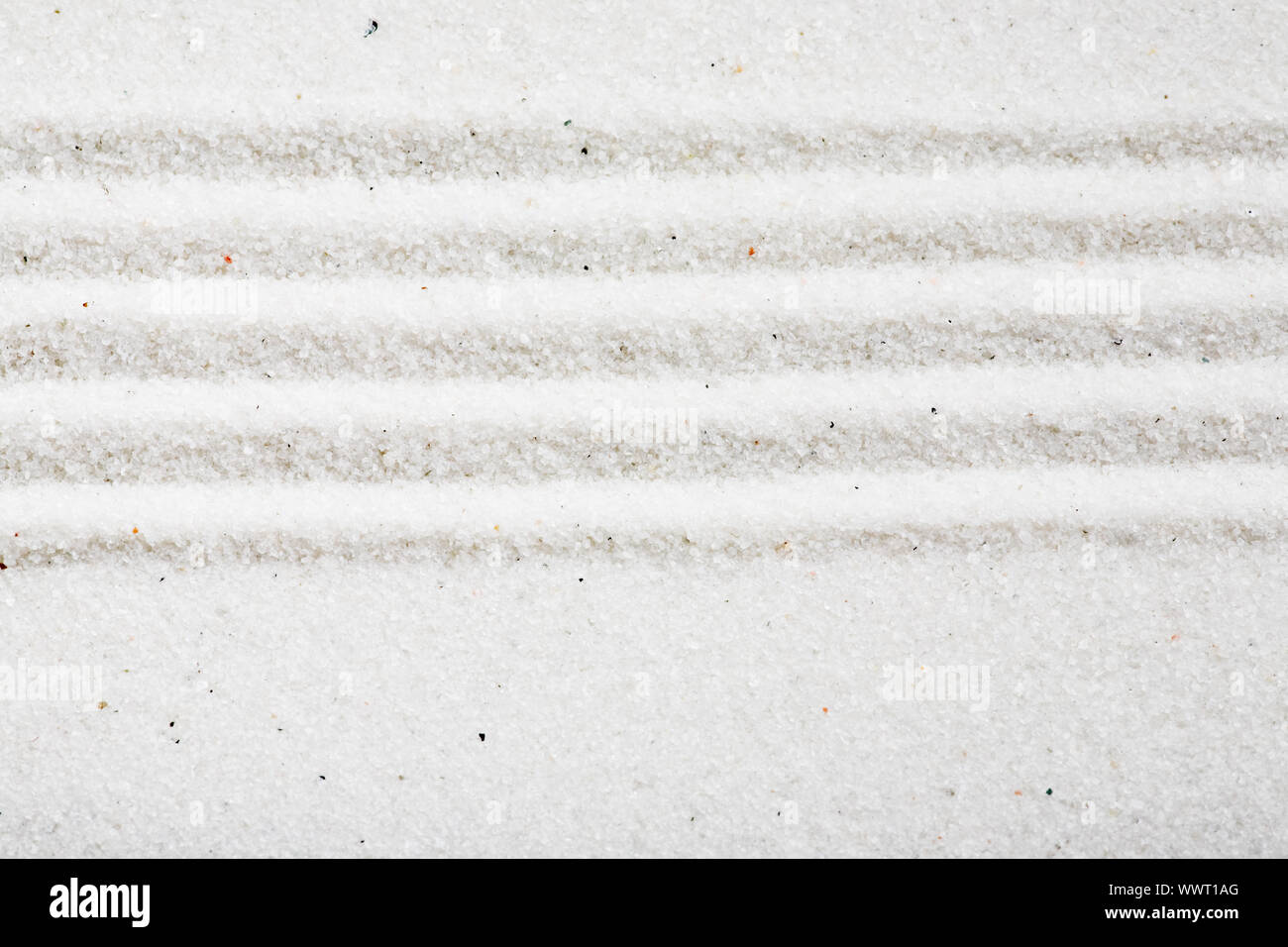 A pattern in white sand, background image Stock Photo - Alamy