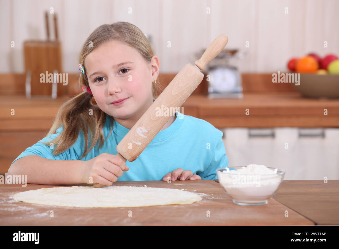 Little girl with rolling pin Stock Photo - Alamy