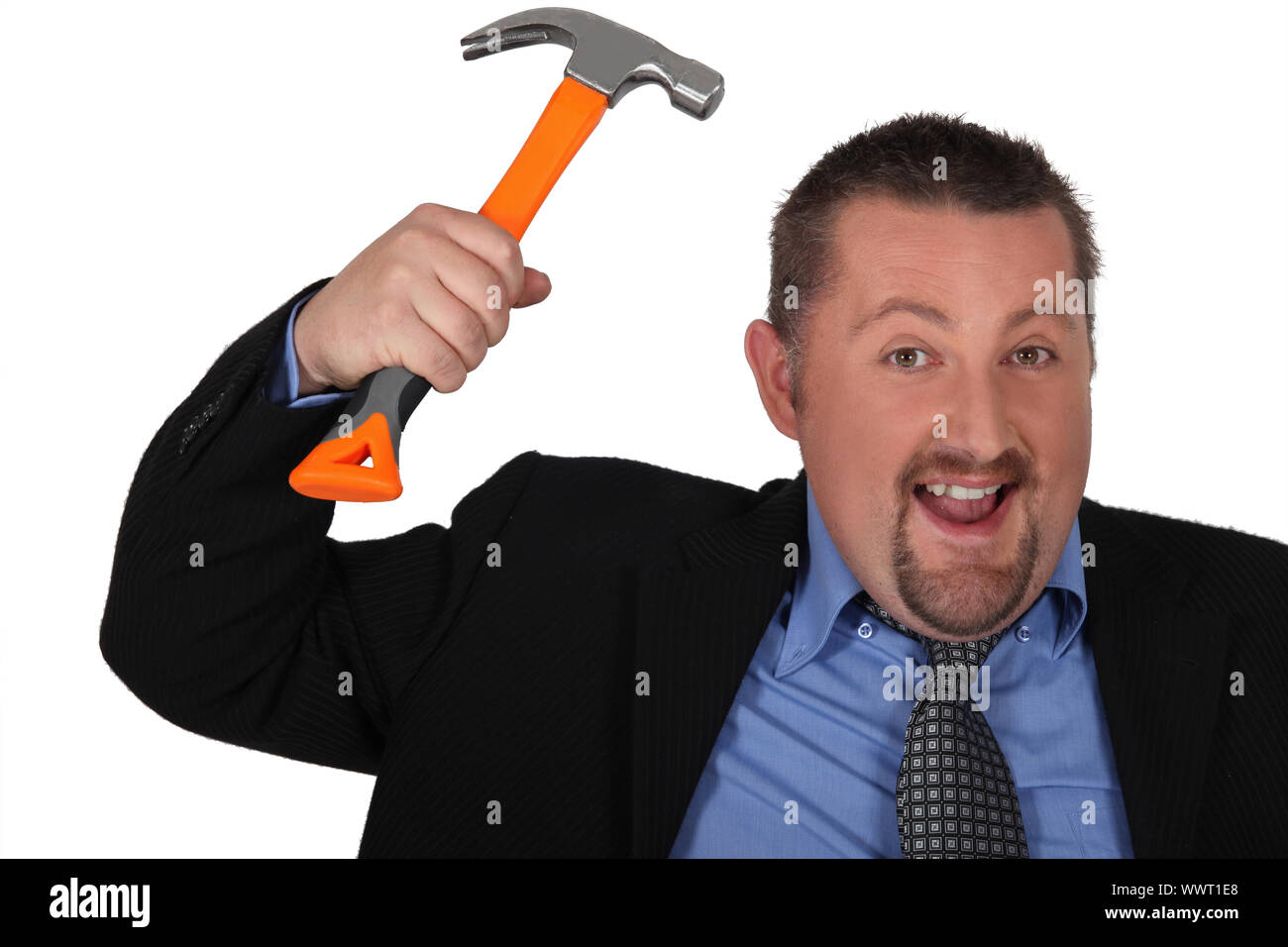 a foolish business man with a hammer Stock Photo - Alamy