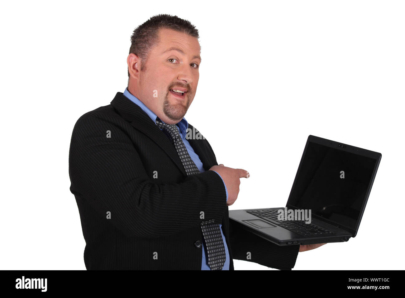 Man pointing at laptop Stock Photo - Alamy