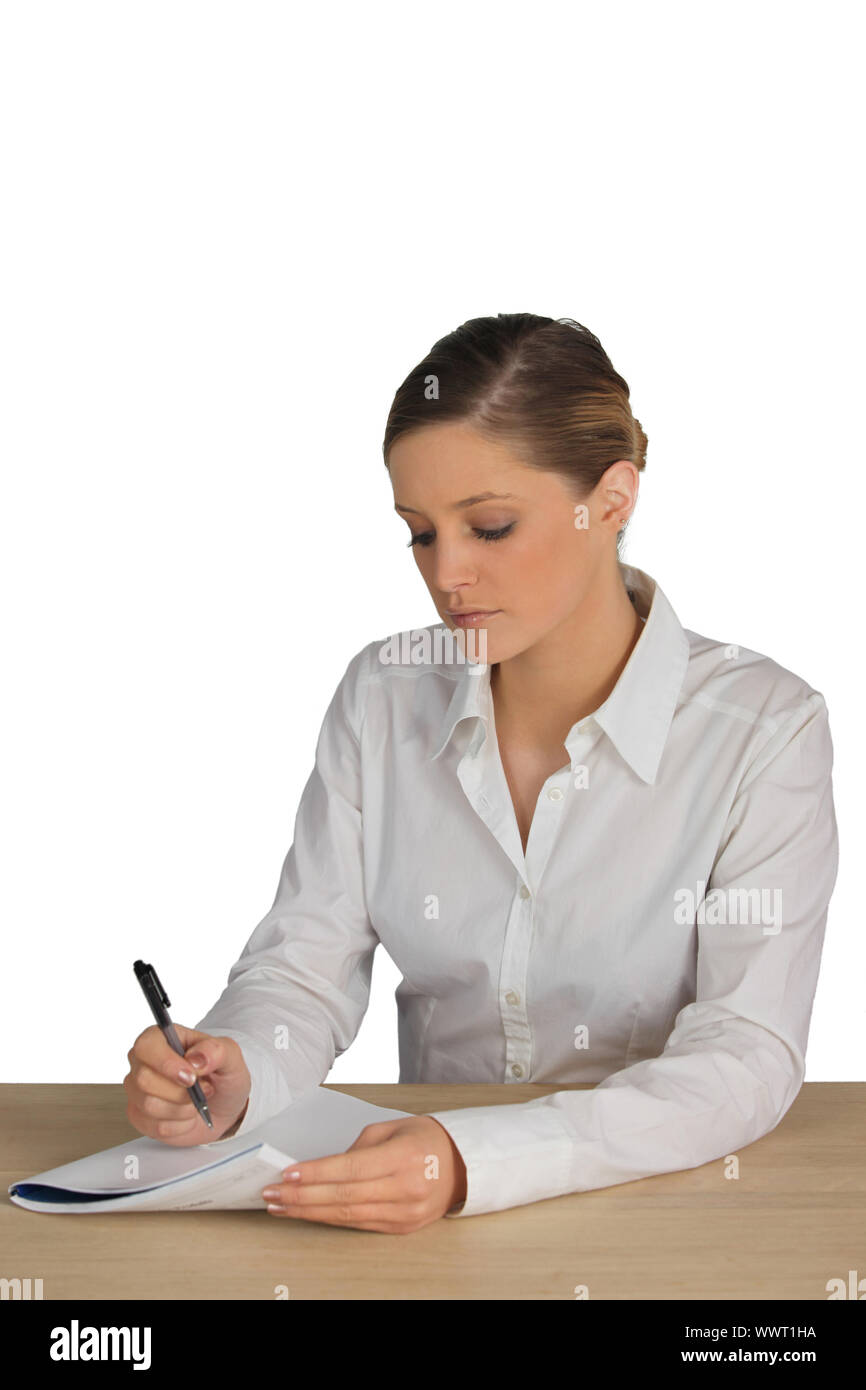 Employee filling in document Stock Photo - Alamy
