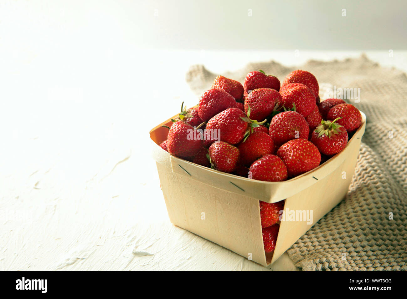 Big wooden boxes with fresh strawberries isolated on white background ...