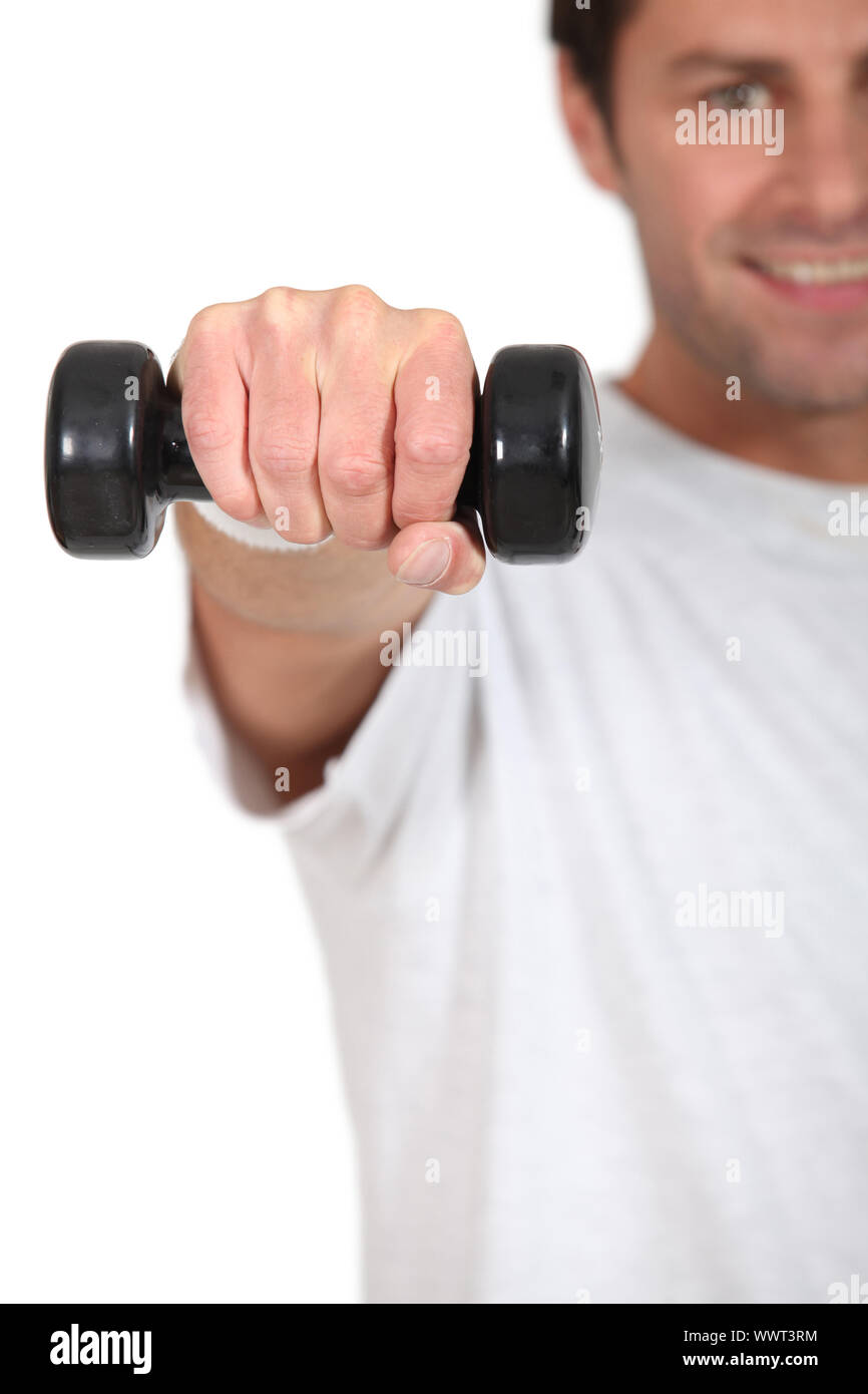 Young with weights in hand Stock Photo - Alamy