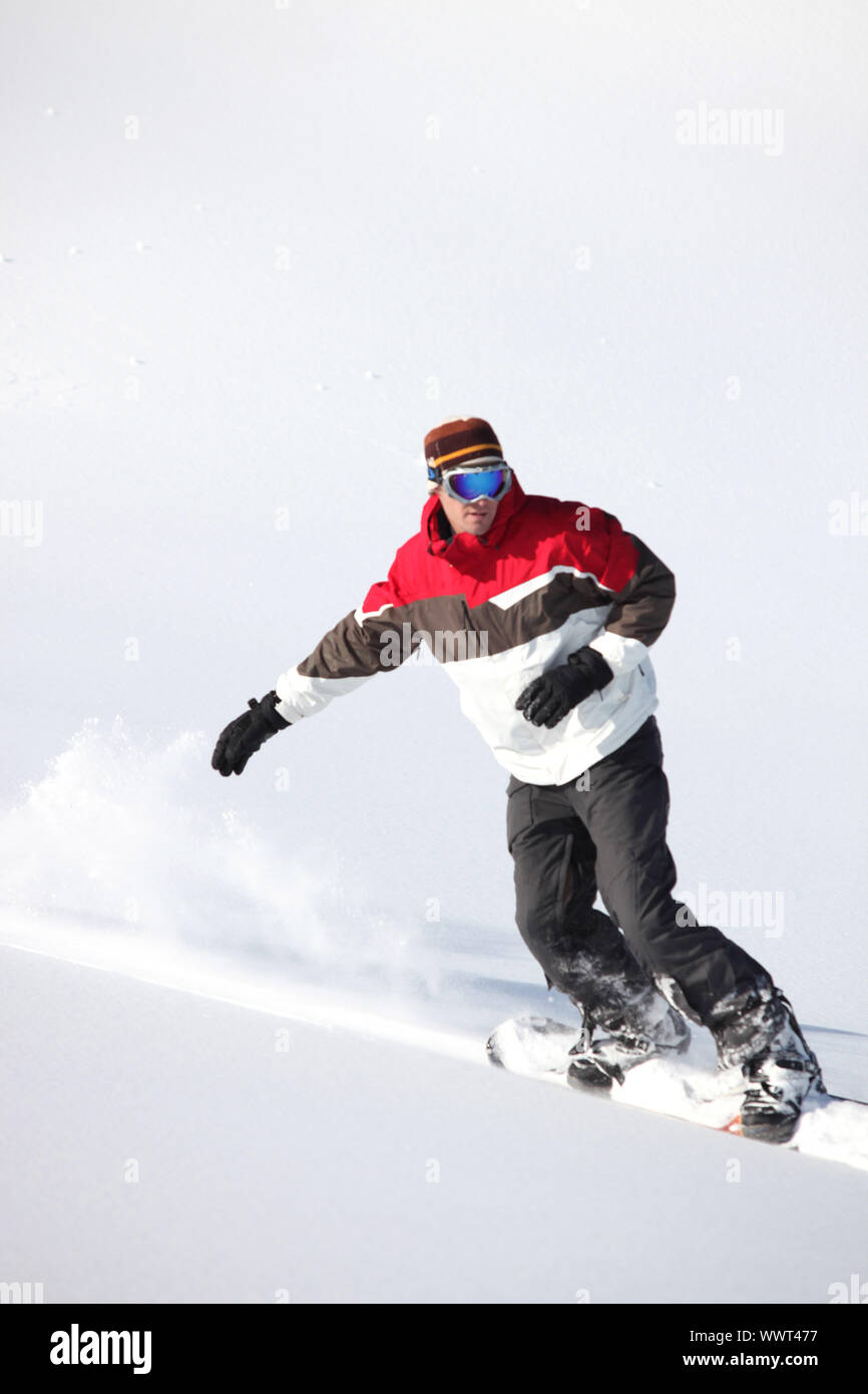 Snowboarder downhill in high hi-res stock photography and images - Alamy