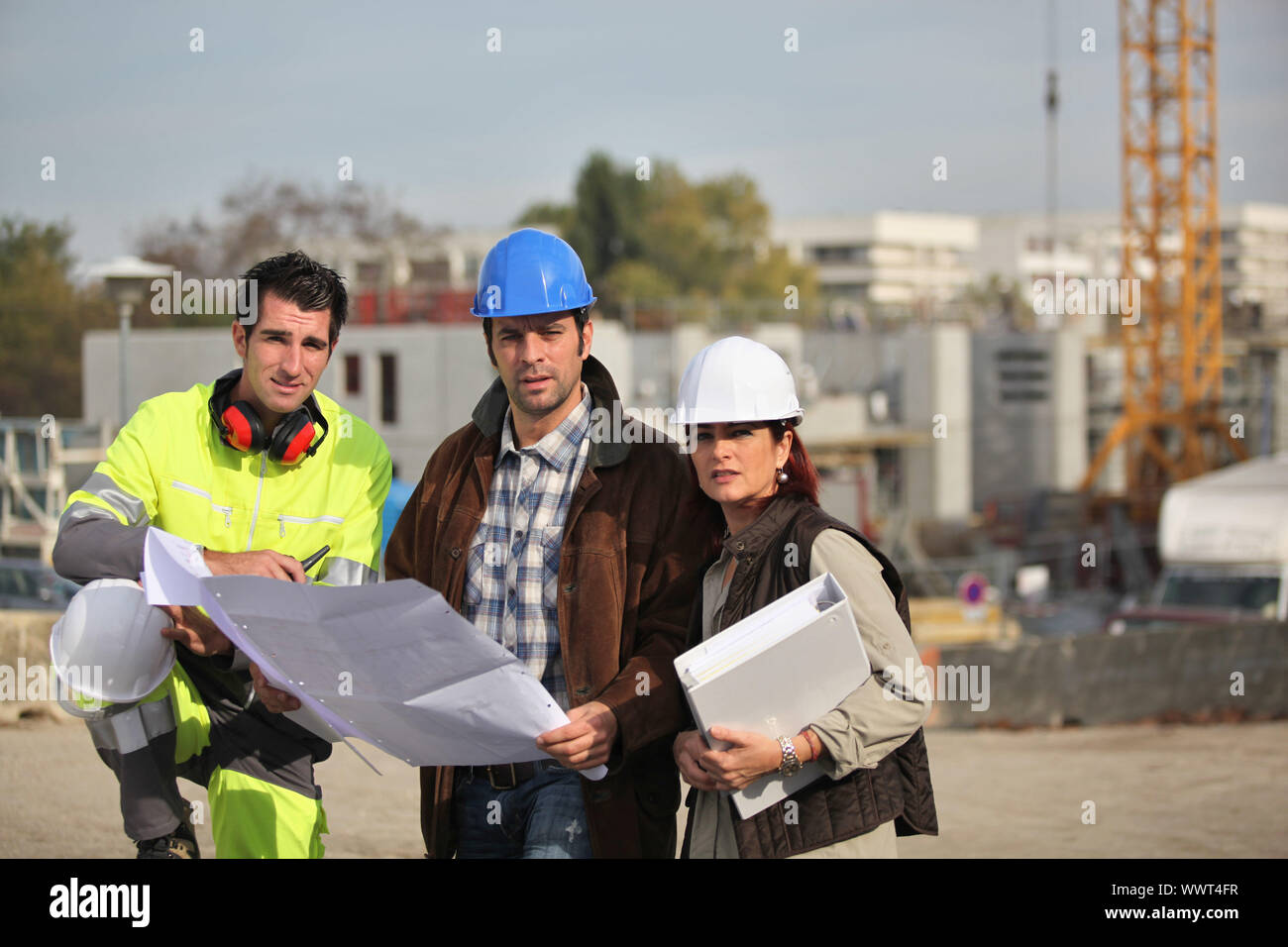 Construction crew working on site Stock Photo - Alamy