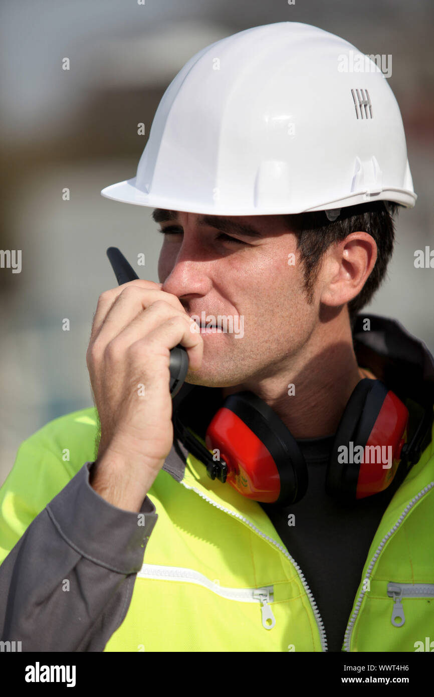 Foreman communication via radio Stock Photo - Alamy