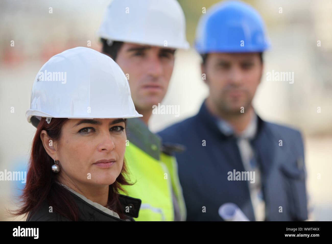 Three architect colleagues at construction site Stock Photo - Alamy