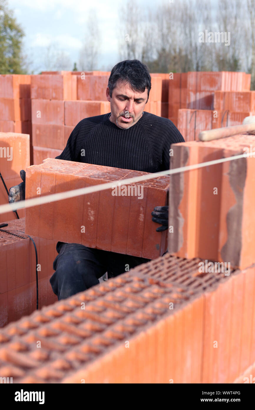 mason on a construction site Stock Photo - Alamy