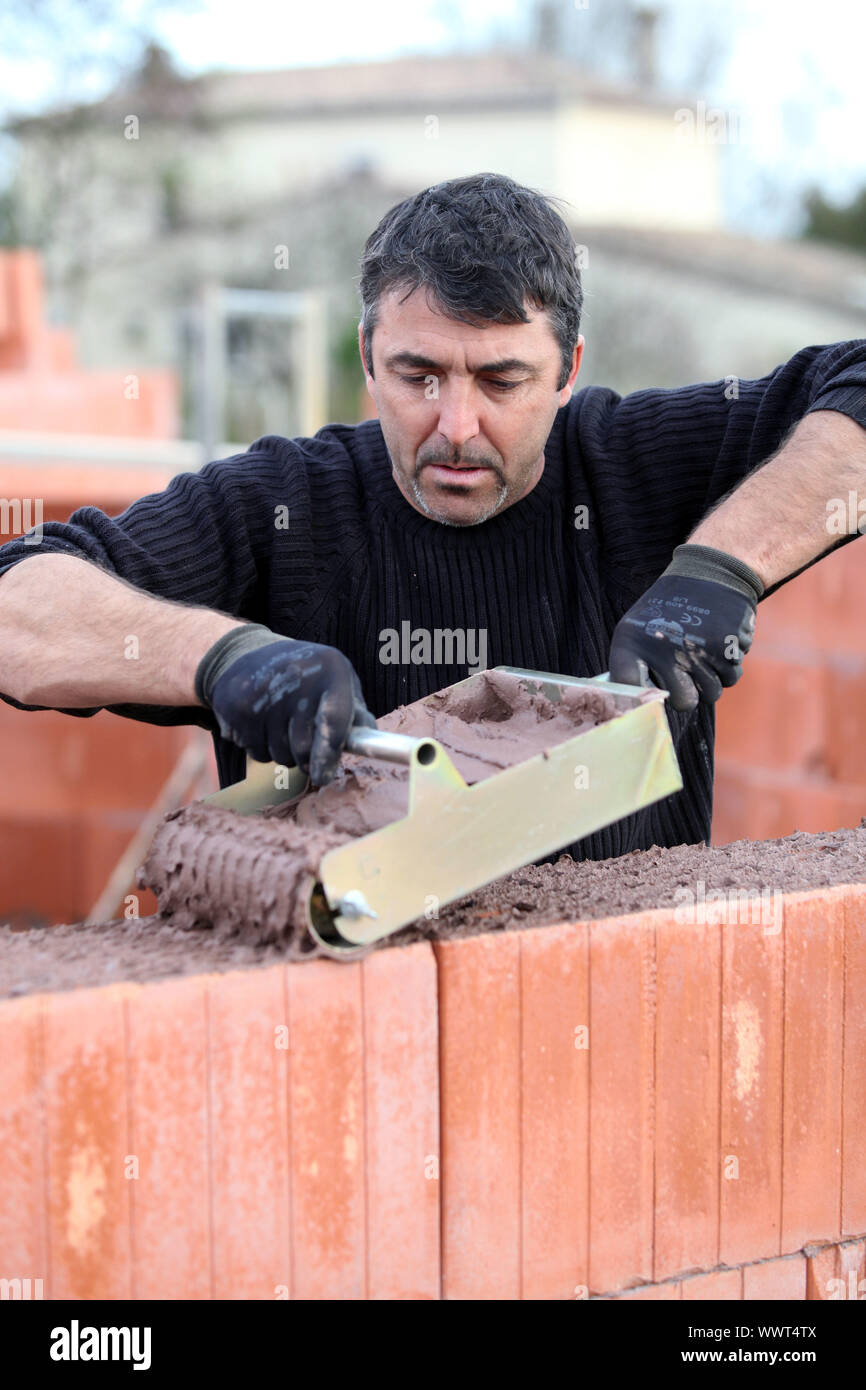Bricklayer building a house Stock Photo - Alamy