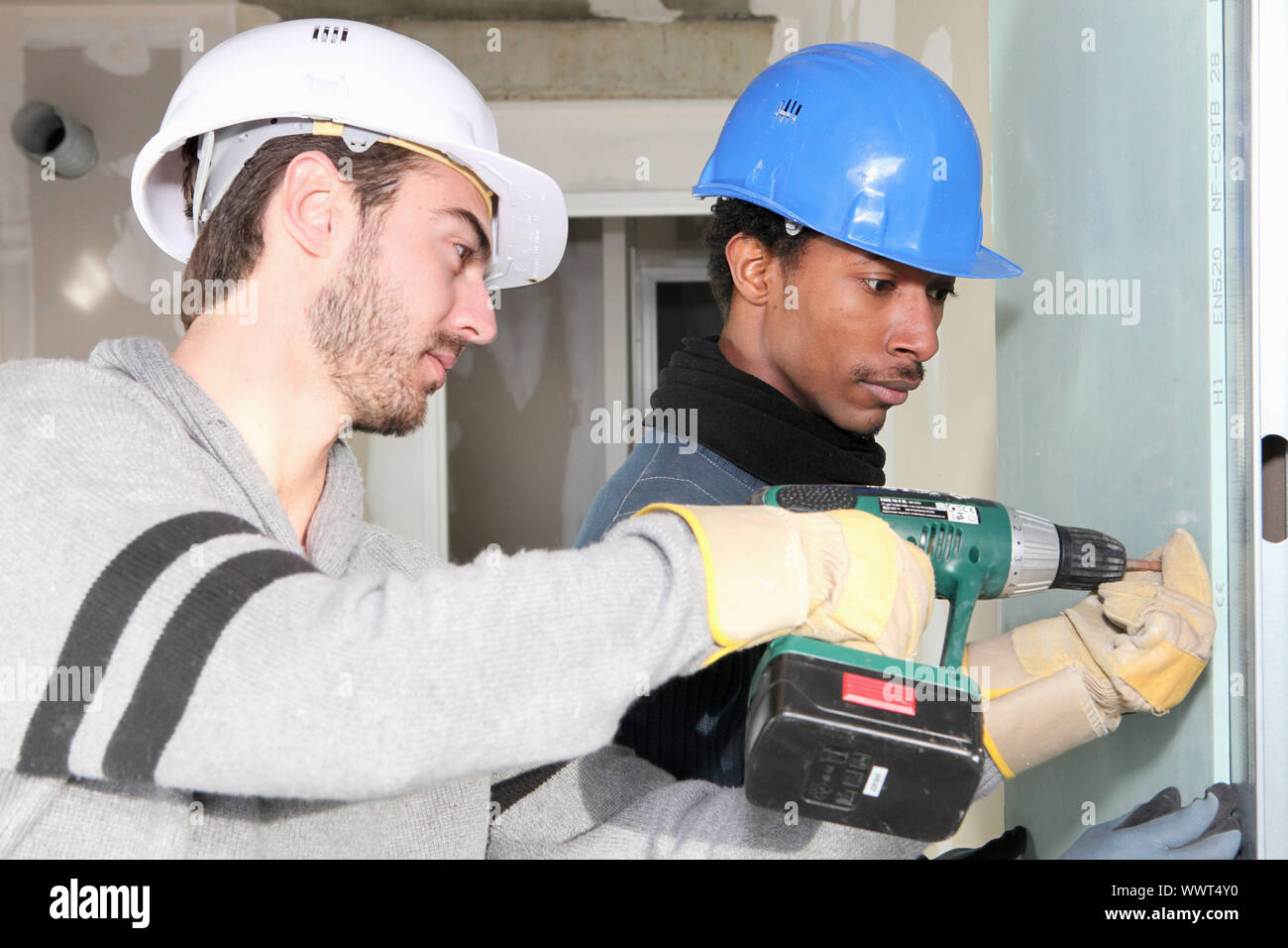 Man using a power tool Stock Photo - Alamy