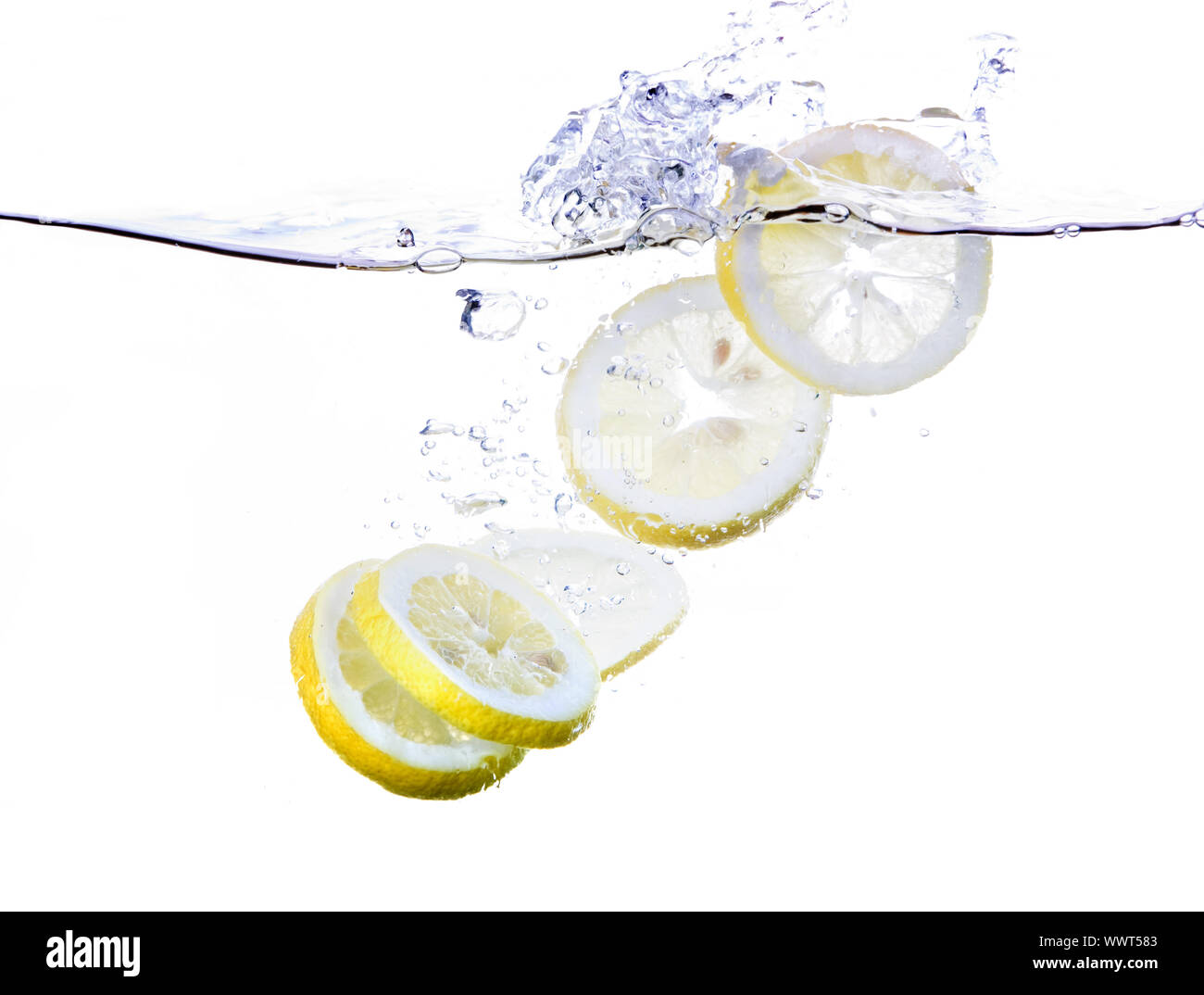Lemon slices splashing in water - refreshing concept Stock Photo - Alamy