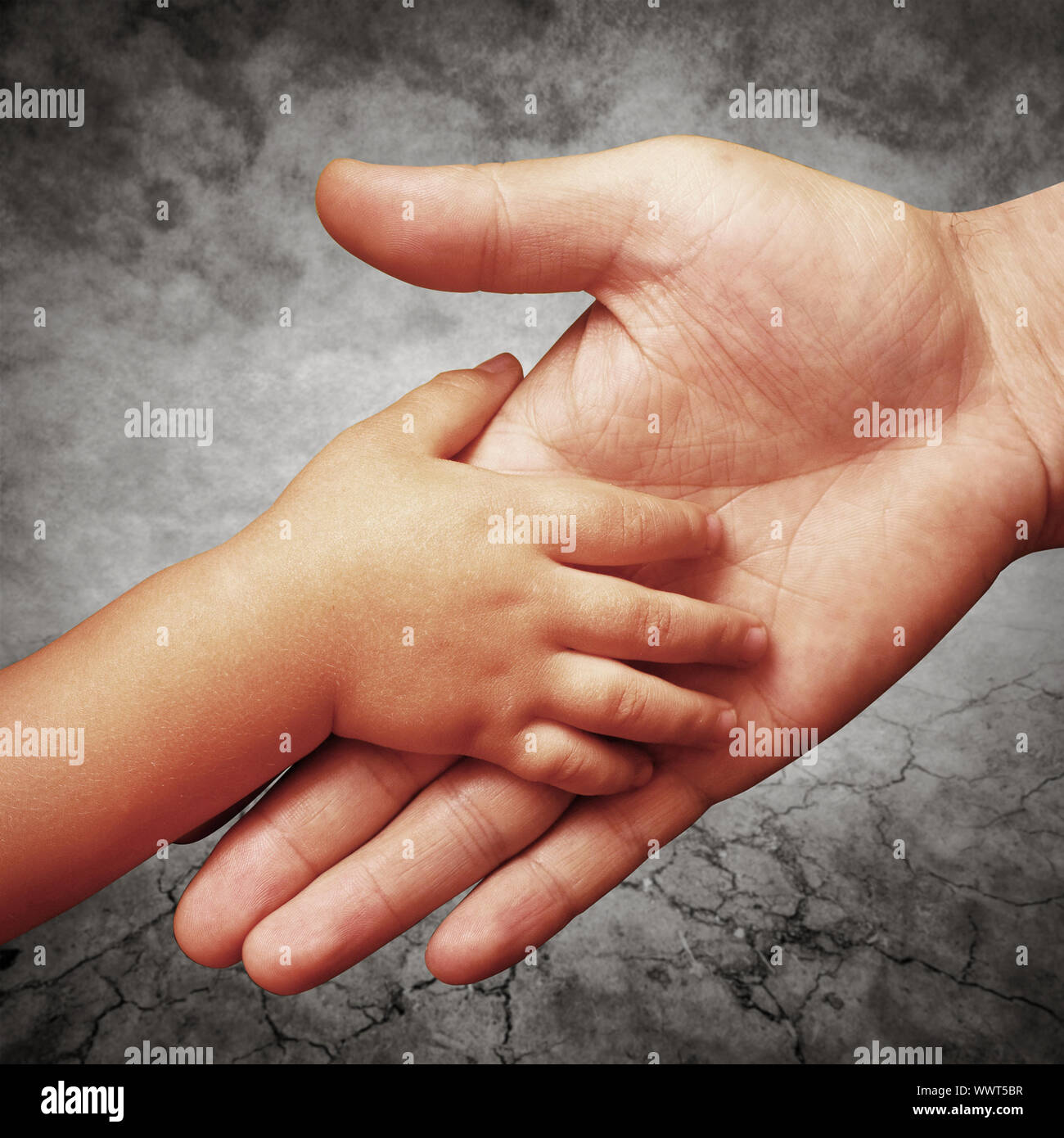 hand holds the hand of his father's son Stock Photo - Alamy