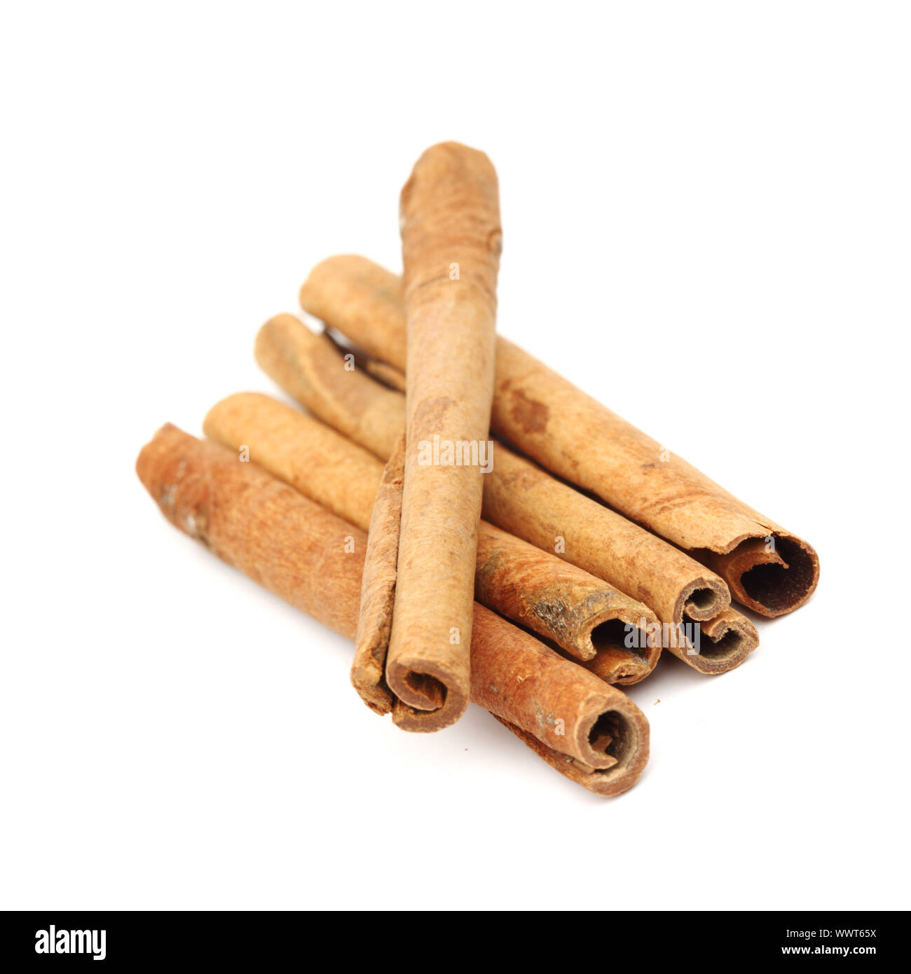 cinnamon pile isolated on white Stock Photo - Alamy