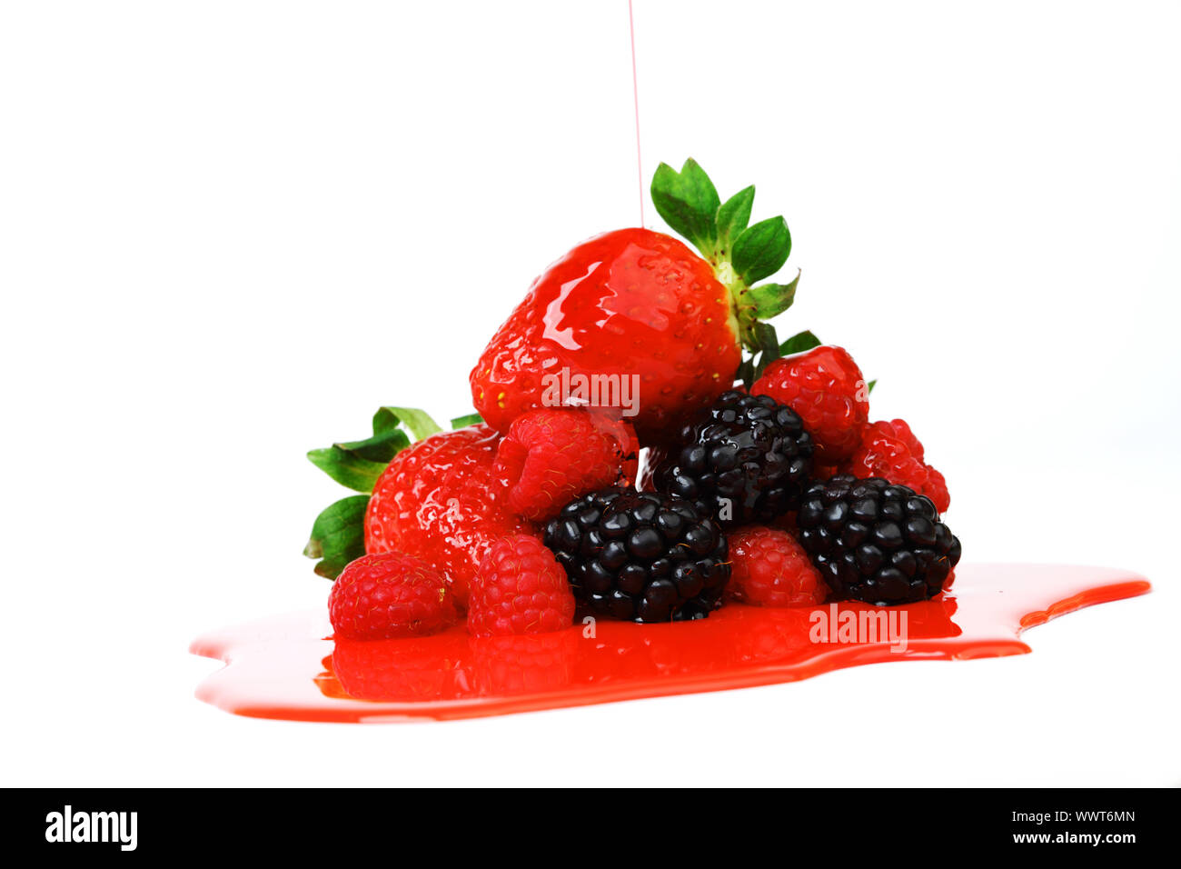 big berry pile in syrup isolated on white Stock Photo - Alamy