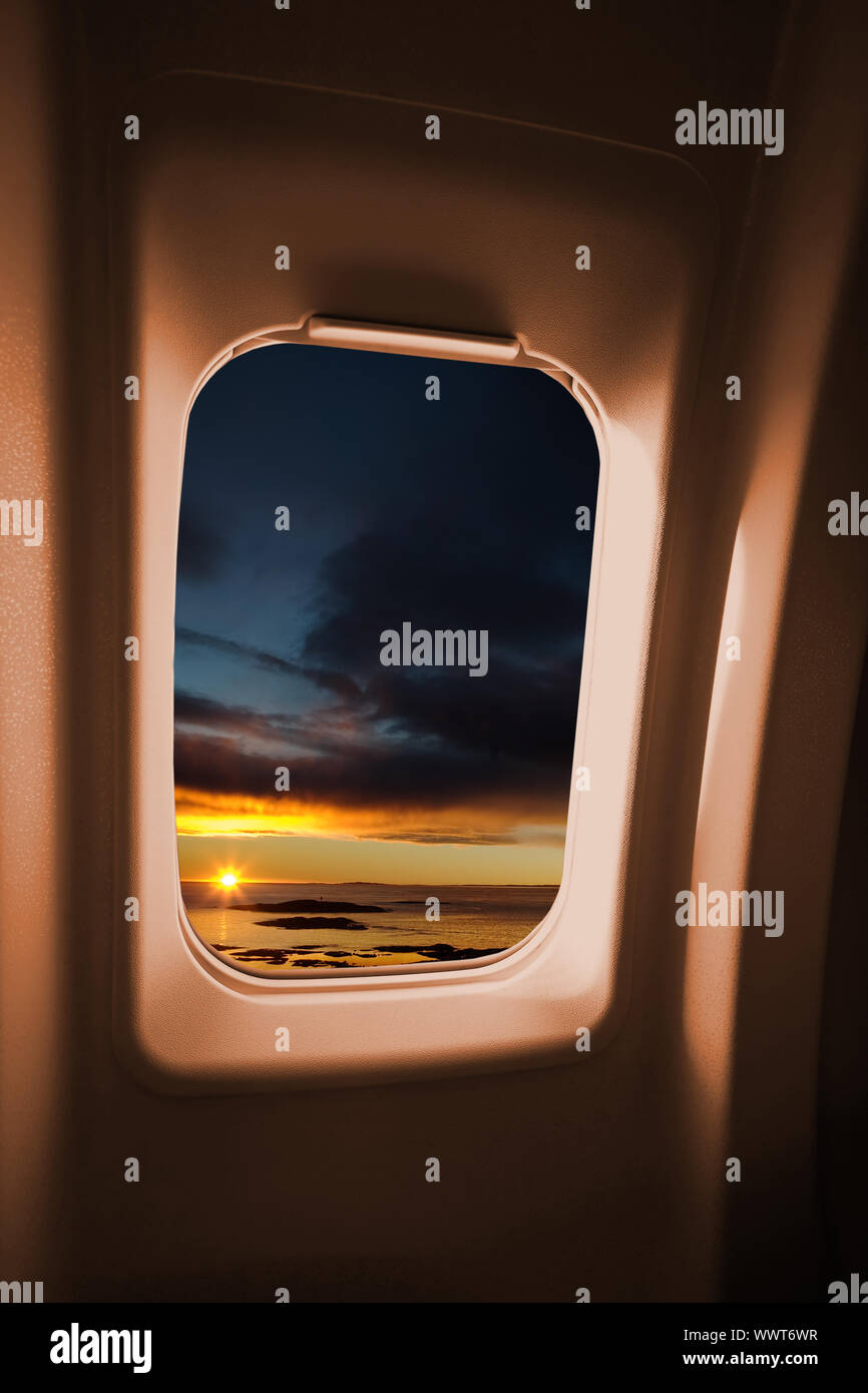 A sunset landscape from an airplane window Stock Photo - Alamy