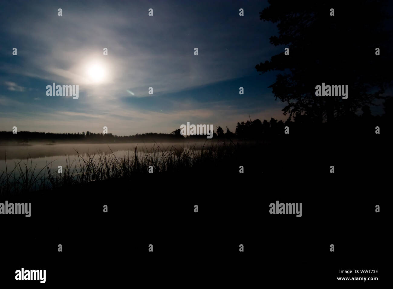 Moon over Lake Stock Photo - Alamy