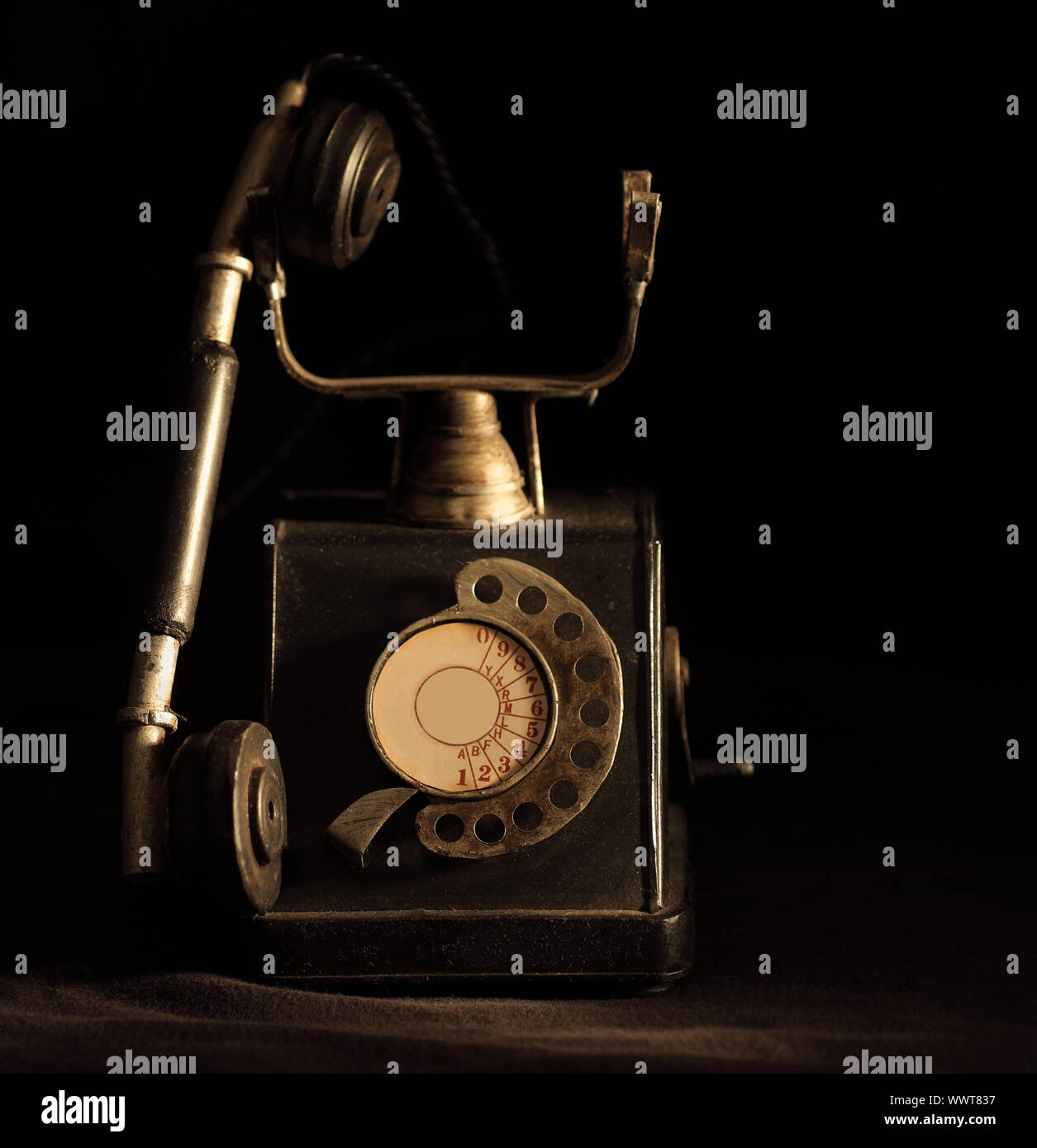 Old retro used telephone isolated on black background Stock Photo - Alamy