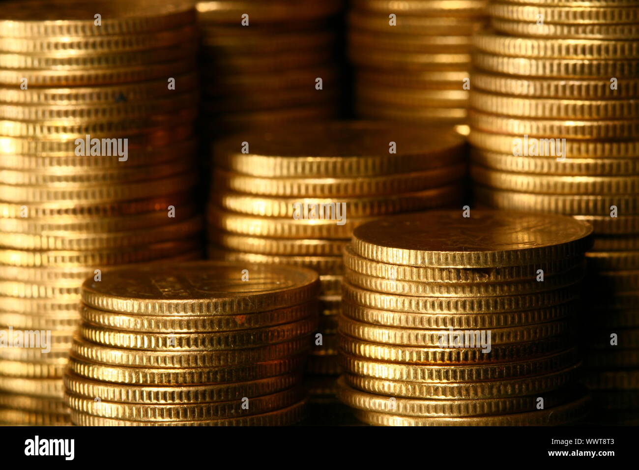 golden piles of coins macro background Stock Photo - Alamy