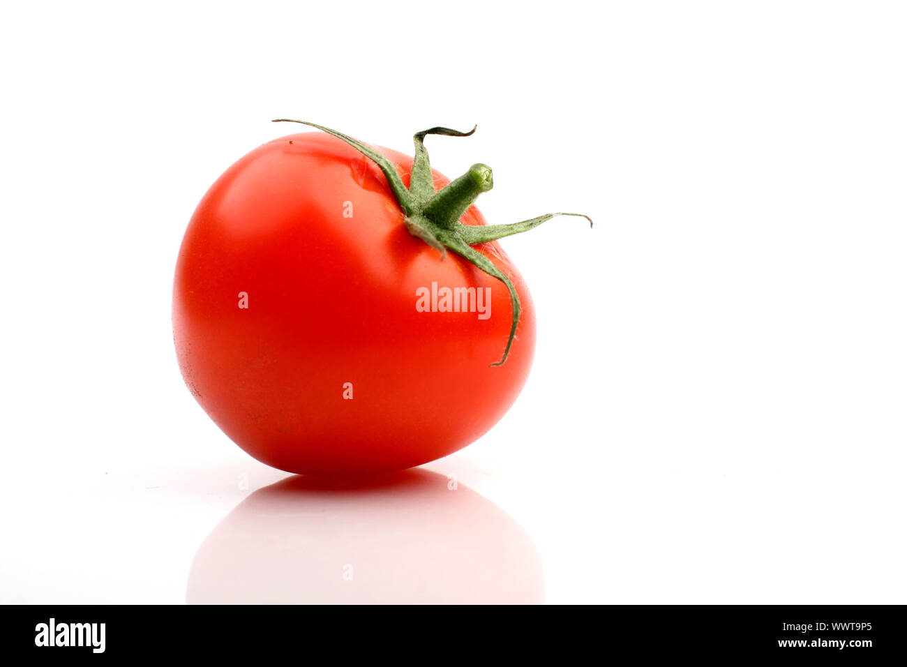one tomato isolated on white background Stock Photo - Alamy