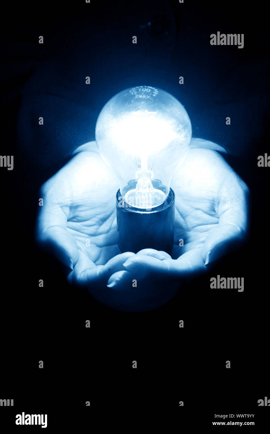 lamp in hand idea concept Stock Photo - Alamy