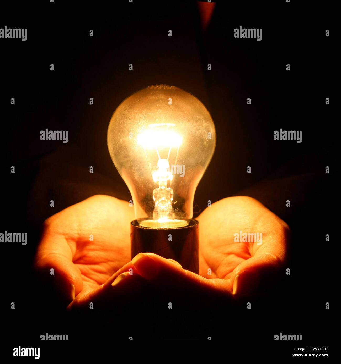 lamp in hand idea concept Stock Photo - Alamy